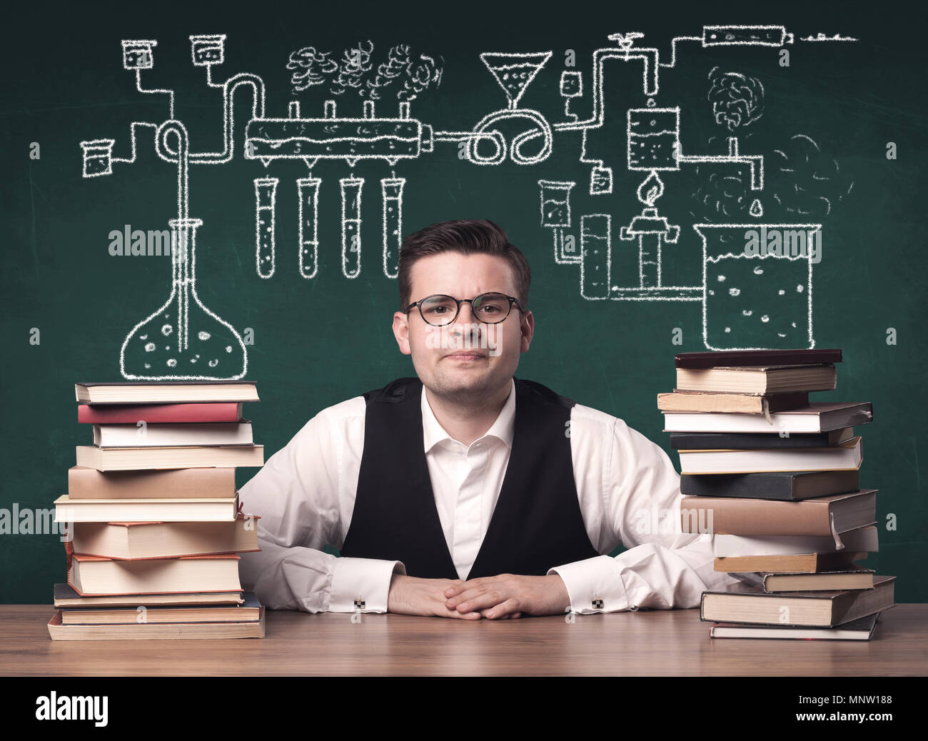 A young chemistry teacher in the middle of a chemical process ...