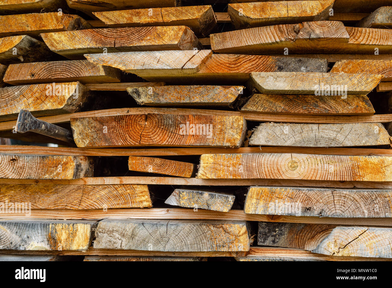 Stack of stacked Lumber. Dried wood boards with a crack. Different ...