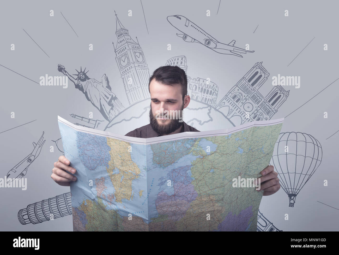 Handsome young man holding a map with famous sightseeing destinations ...