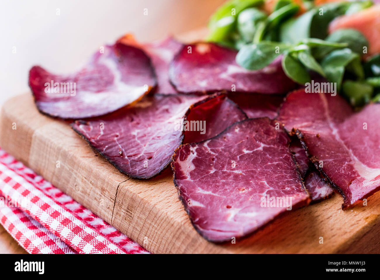 Dried smoked meat slices hi-res stock photography and images - Alamy