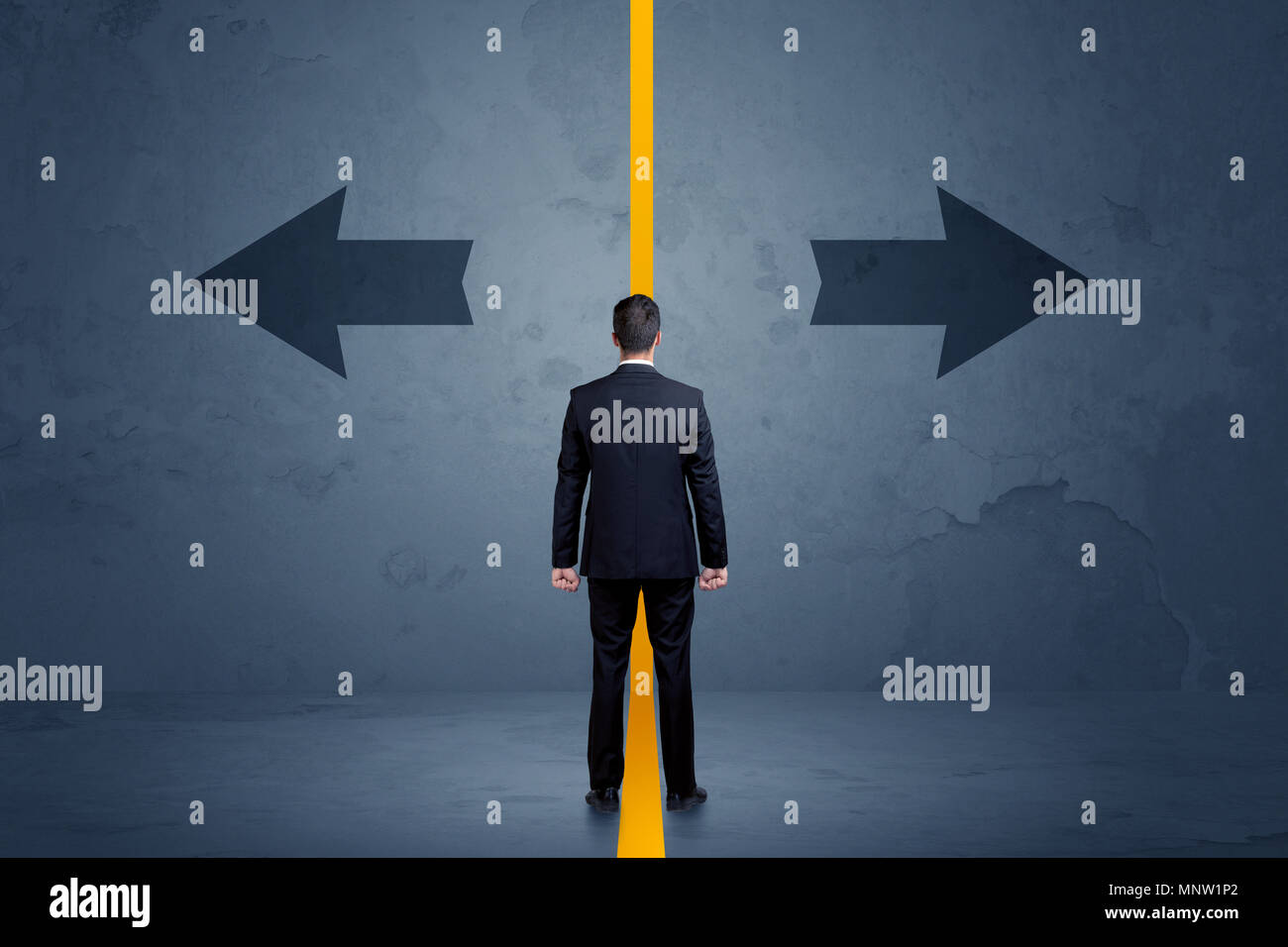 Business person choosing between two options separated by a yellow ...