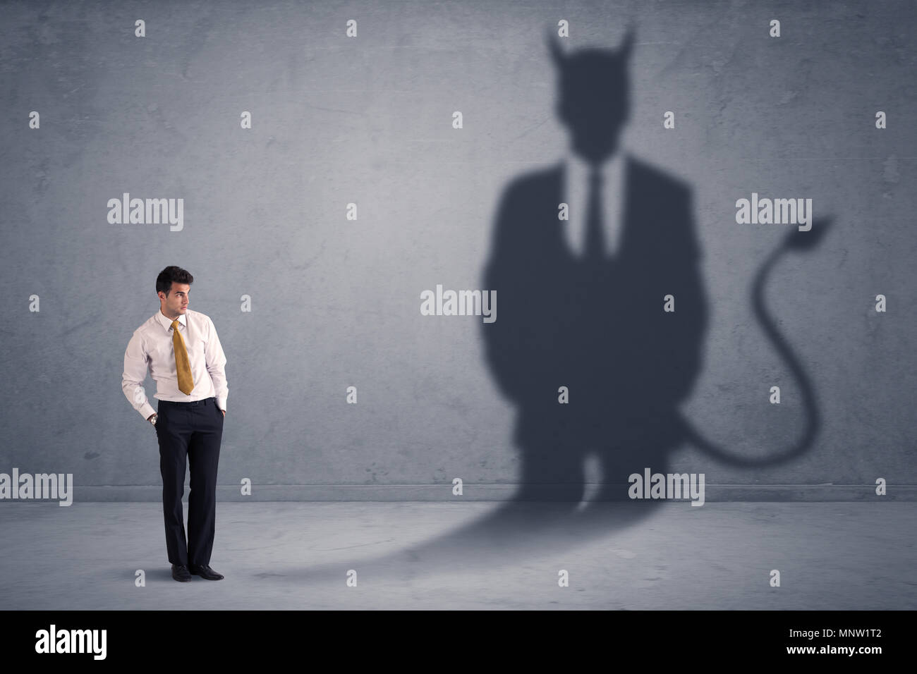 Business man looking at his own devil demon shadow concept background ...