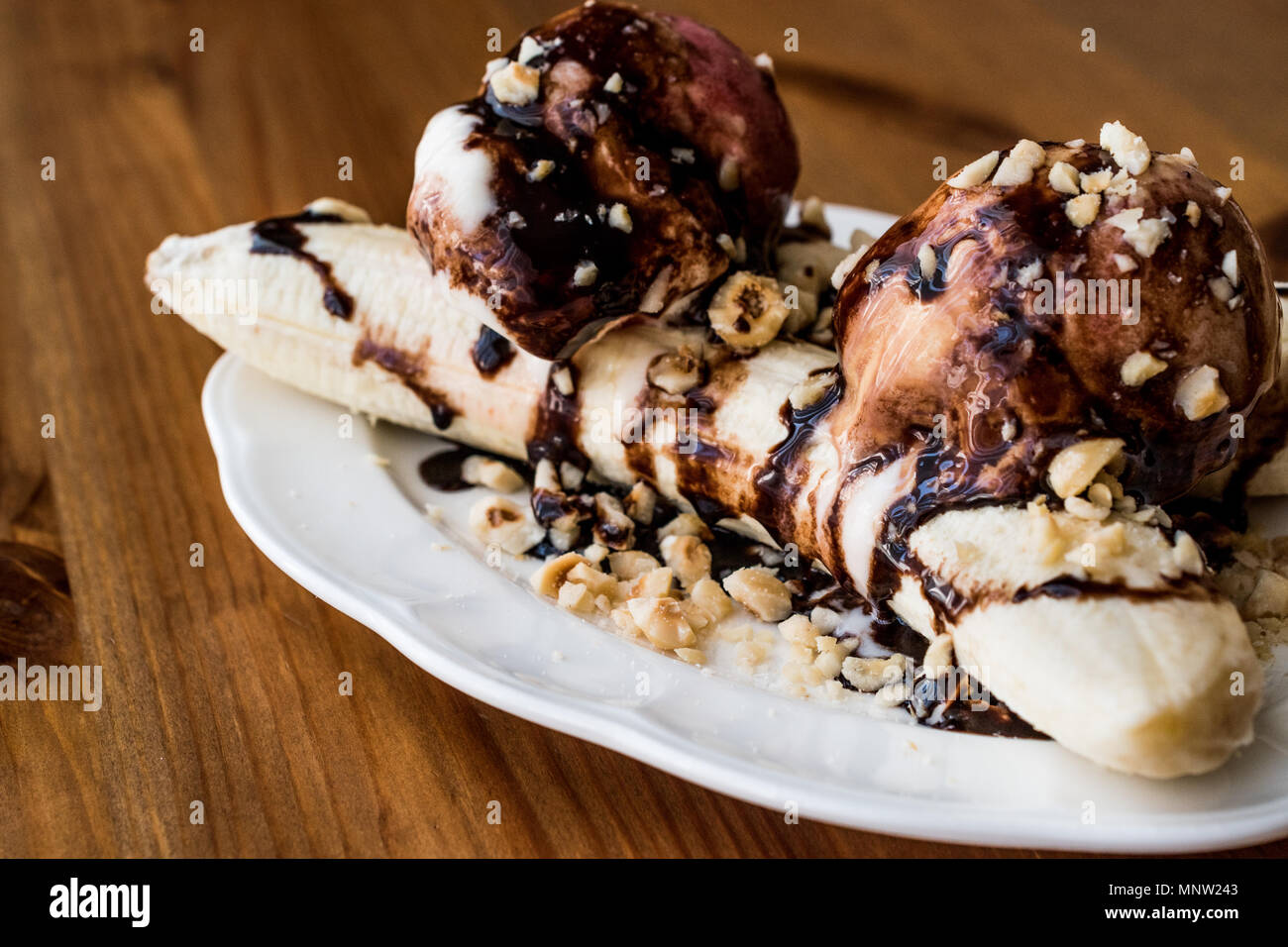 Banana Split with ice cream chocolate sauce and Hazelnuts. Dessert ...