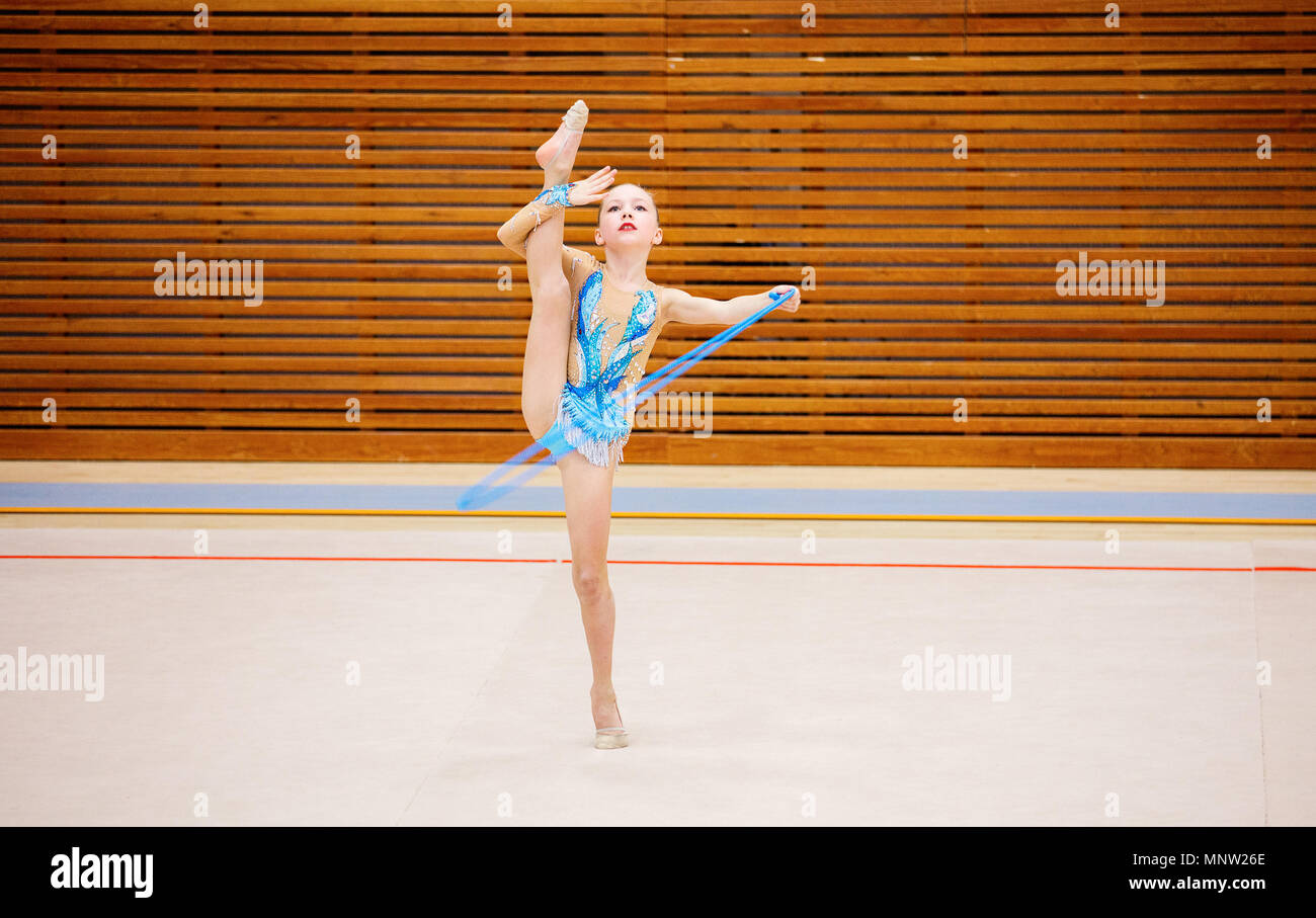 Adorable girl with rope competing in rhythmic gymnastics Stock Photo ...