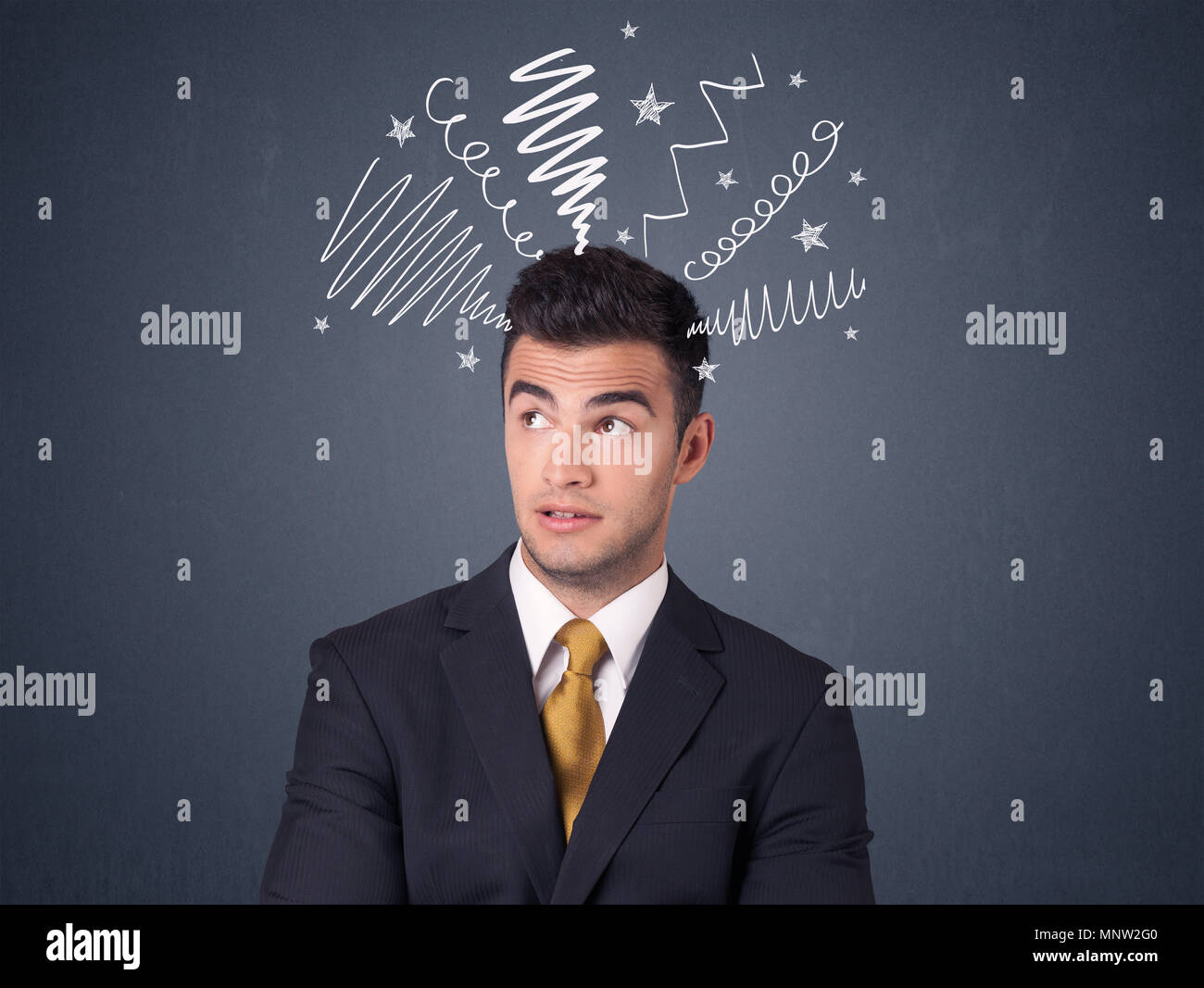 Young businessman with white scribbles around his head Stock Photo - Alamy