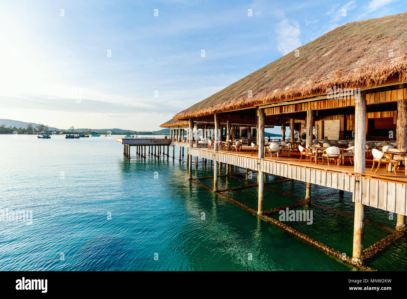 Tropical overwater bar in a luxury resort Stock Photo - Alamy