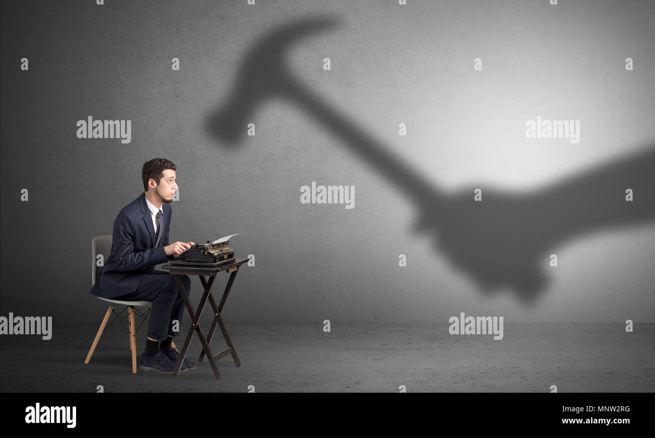 Shadow threatening hard worker man who is afraid Stock Photo - Alamy
