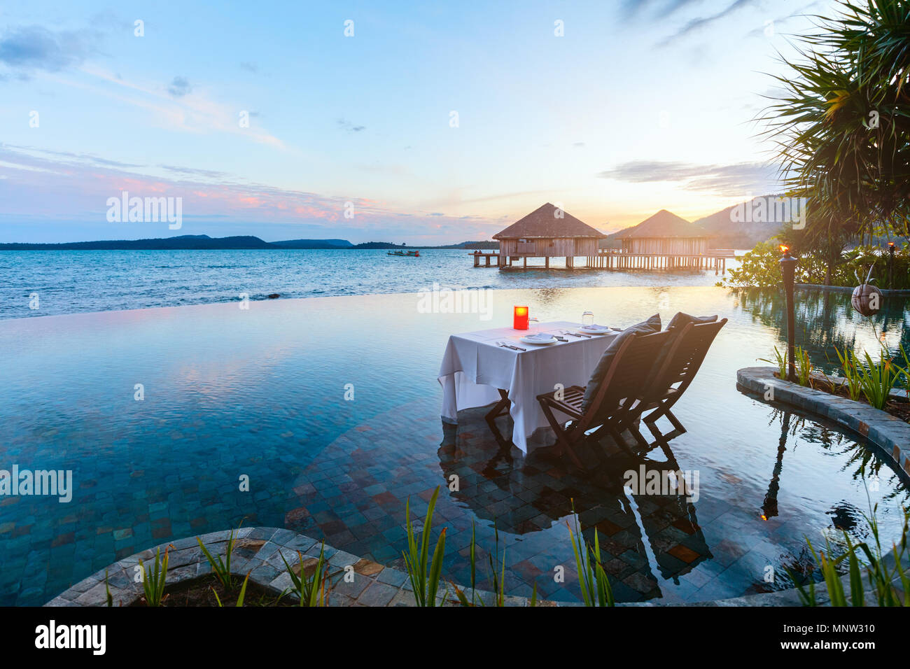 Romantic luxury dinner setting at tropical resort on sunset Stock Photo ...