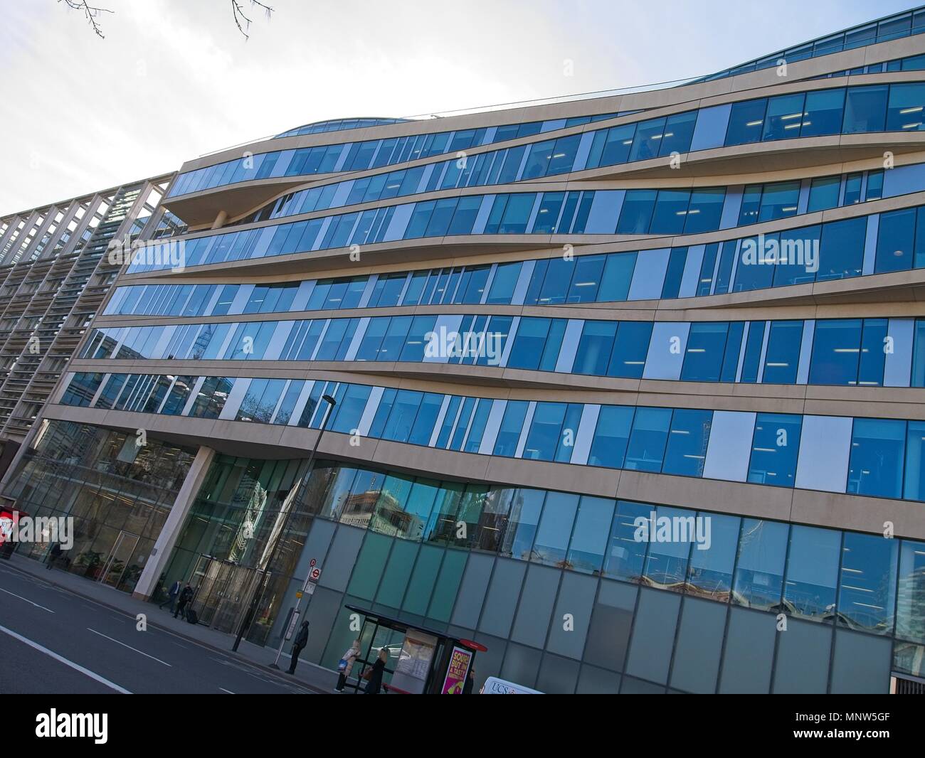 London, UK - April 04 2018: A Contemporary Wavy Shaped Building at dusk ...