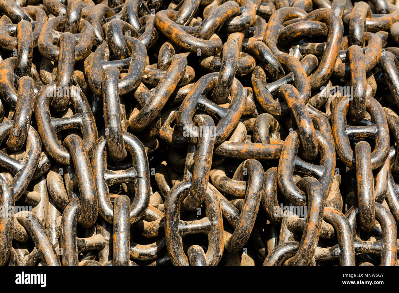 Big pile of a massive metal chain used in shipbuilding Stock Photo - Alamy