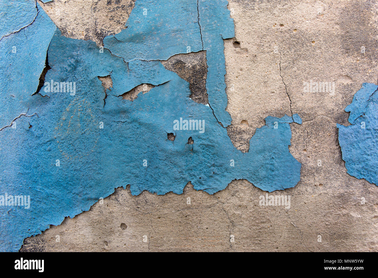 Blue paint peeling plaster gunge wall Stock Photo - Alamy
