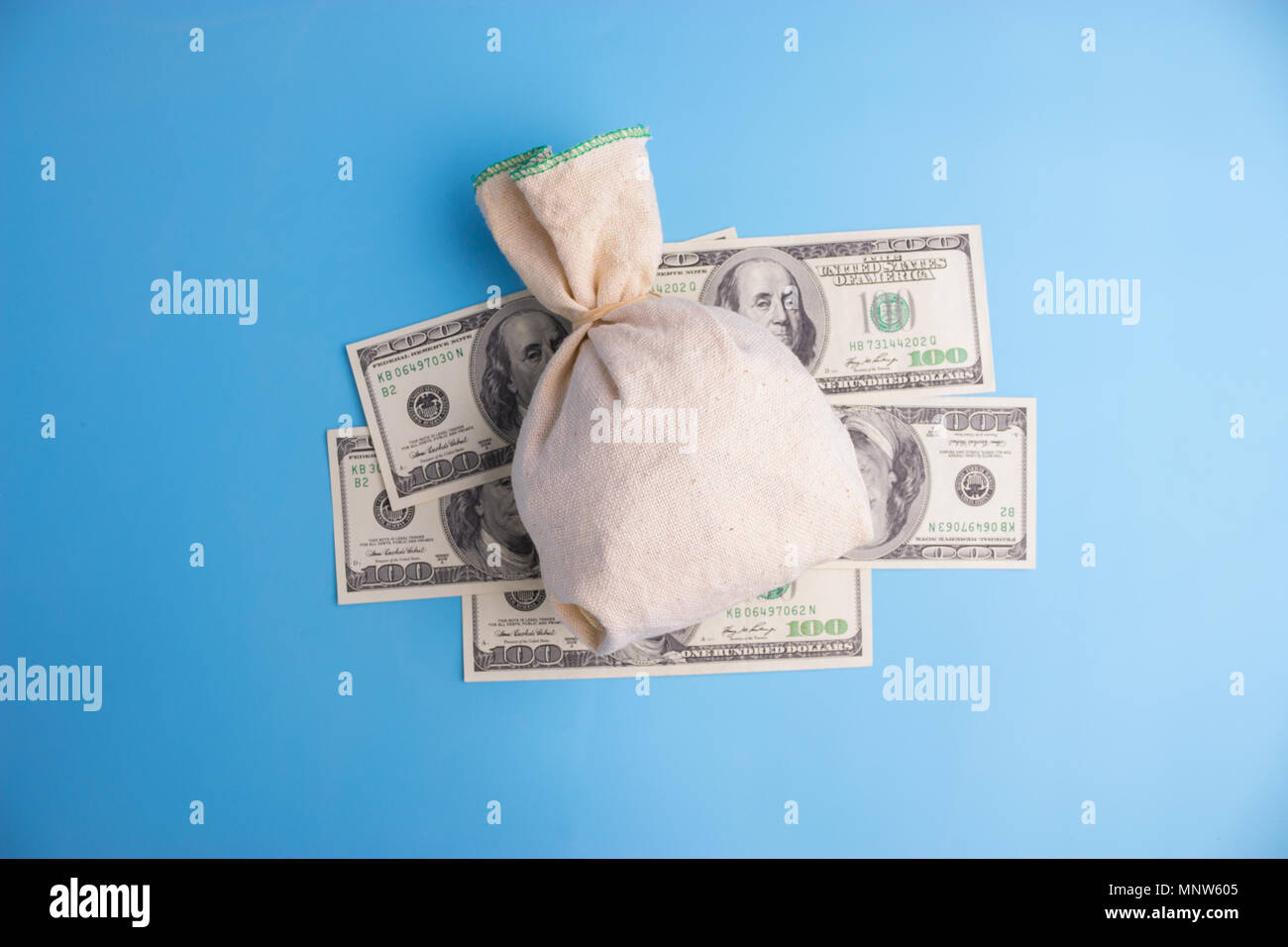 Money Bag, Currency, Paper Currency on blue background Stock Photo - Alamy