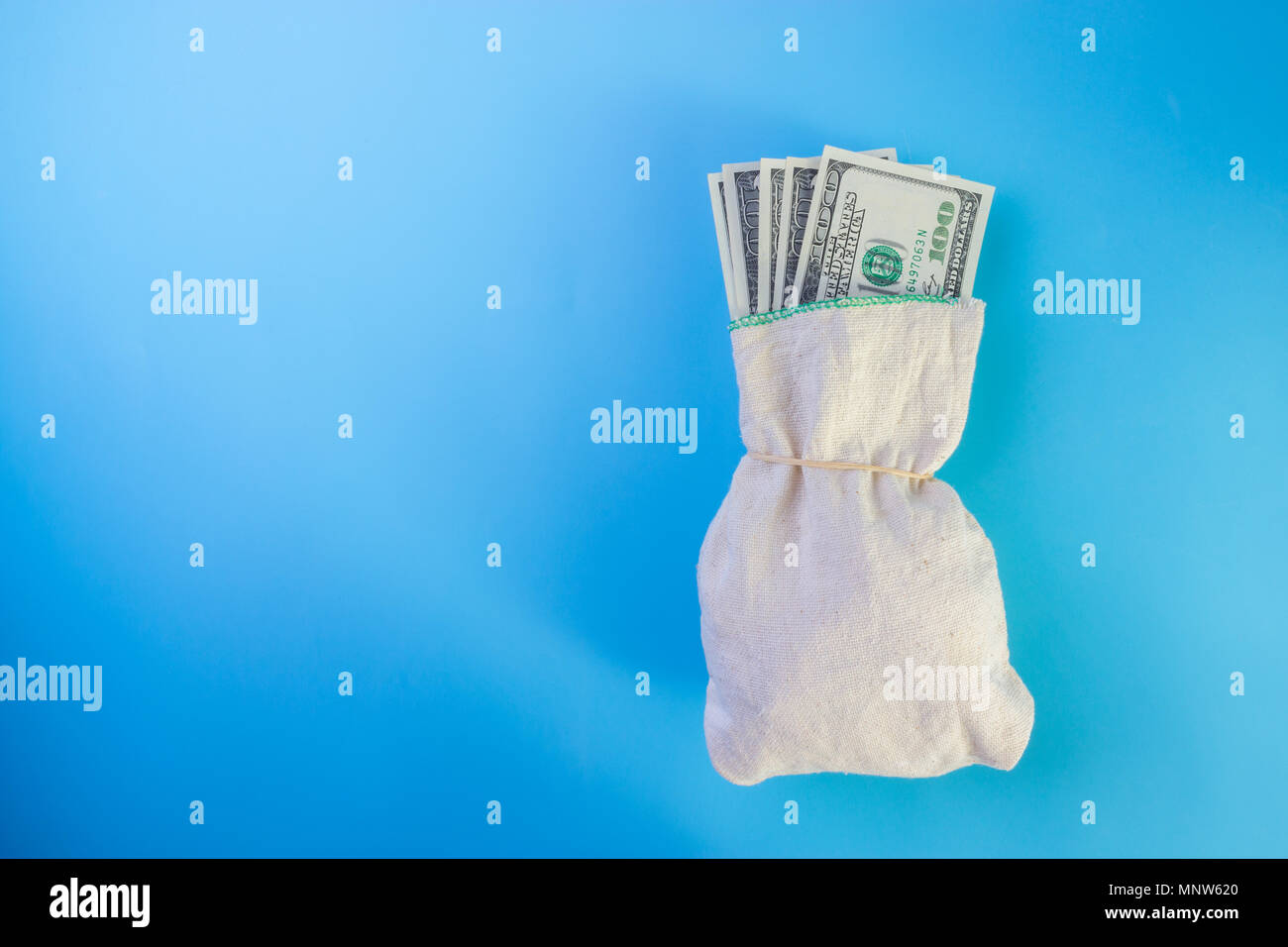 Money Bag, Currency, Paper Currency on blue background Stock Photo - Alamy