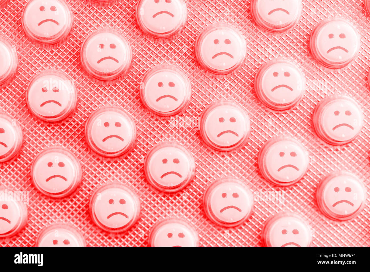 Sad face of pills. negative side effects of drugs Stock Photo - Alamy