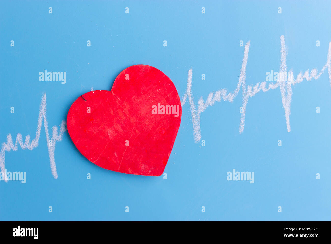 heart and cardiogram on the blue background Stock Photo - Alamy