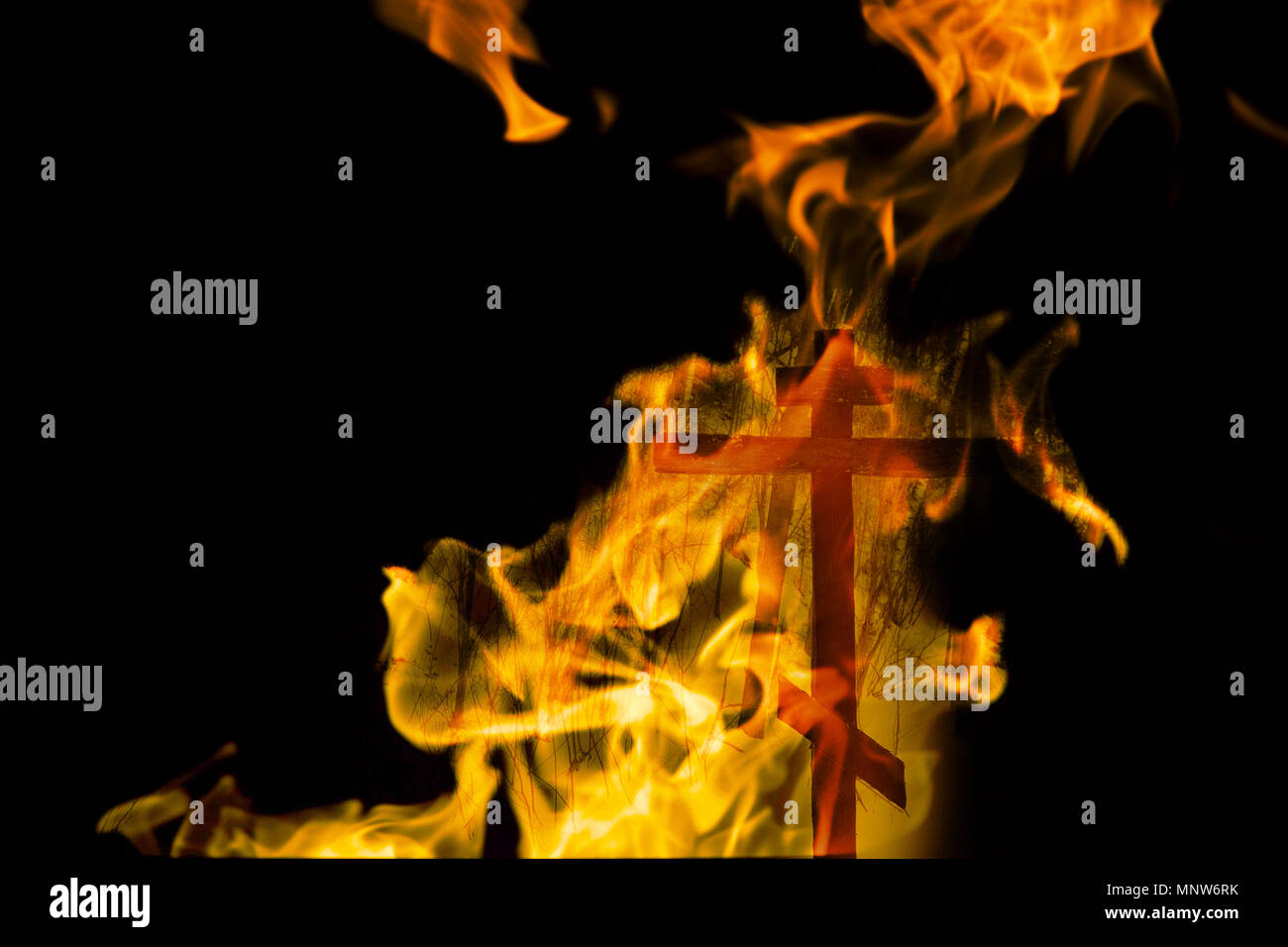 cross in the fire on black background Stock Photo - Alamy