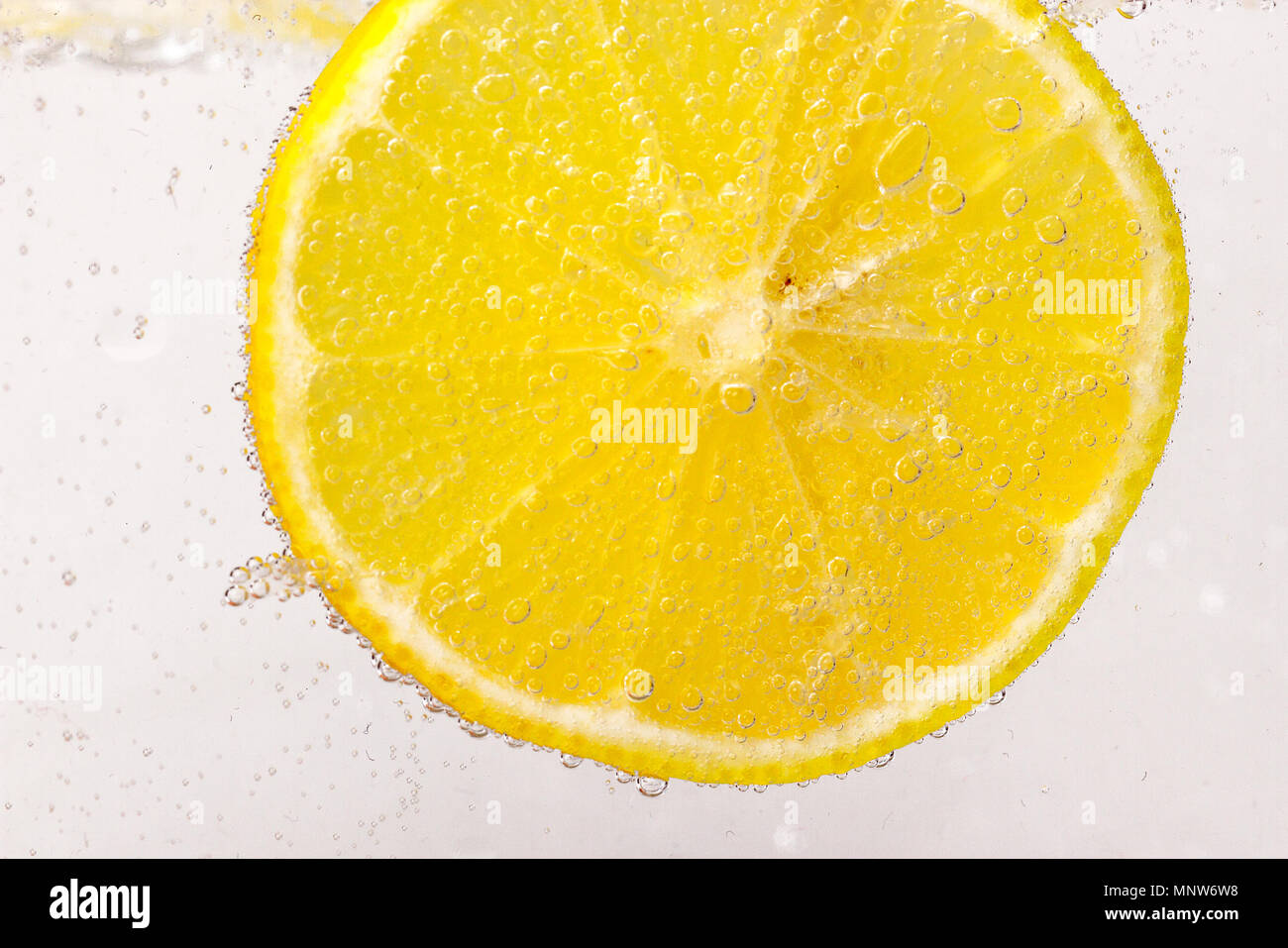 Glass citrus squeezer with lemons and juice Stock Photo - Alamy