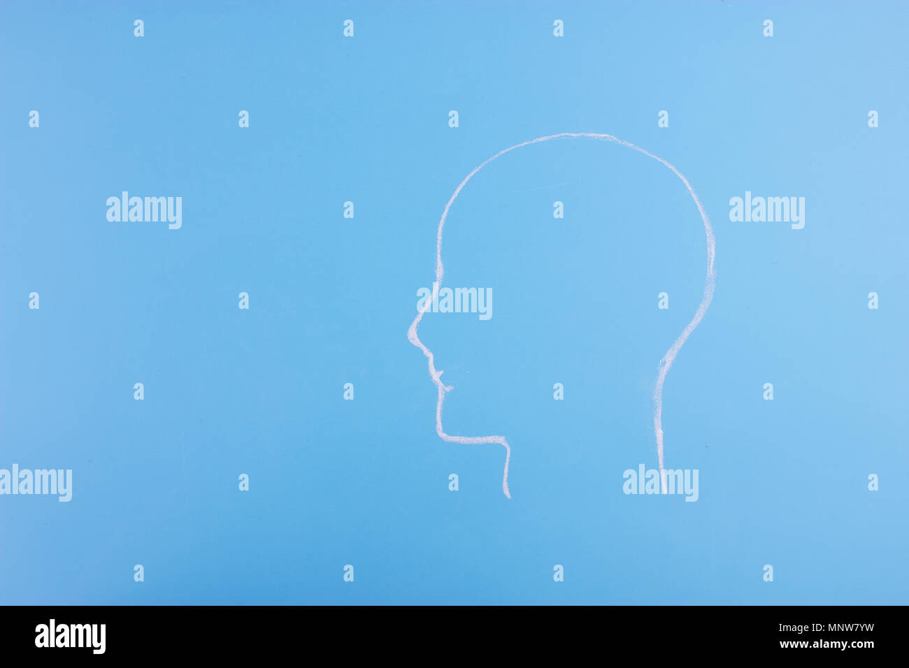 crayon sketched head silhouette on blue background Stock Photo - Alamy