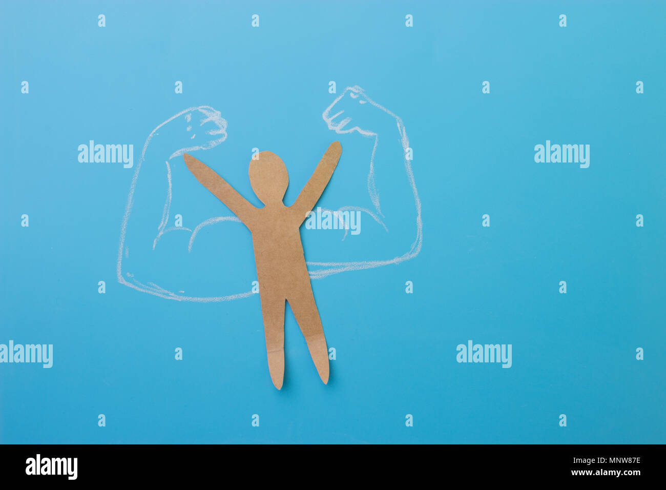 paper man with muscles. self confidence concept Stock Photo - Alamy