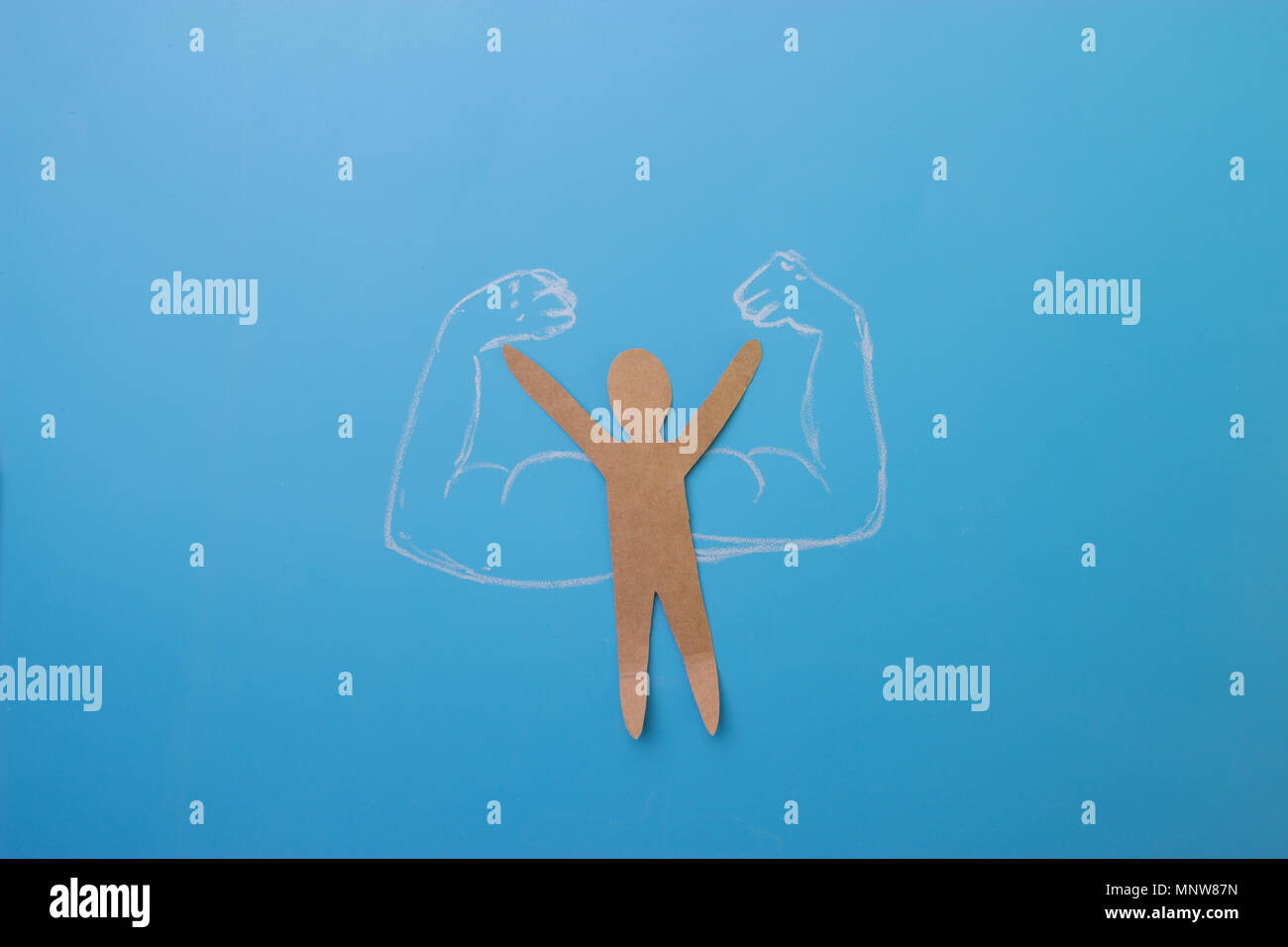 paper man with muscles. self confidence concept Stock Photo - Alamy