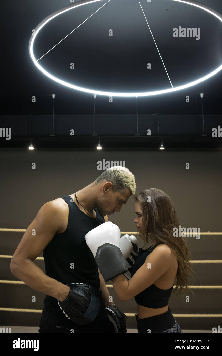 Beautiful sports couple in a boxing ring Stock Photo - Alamy