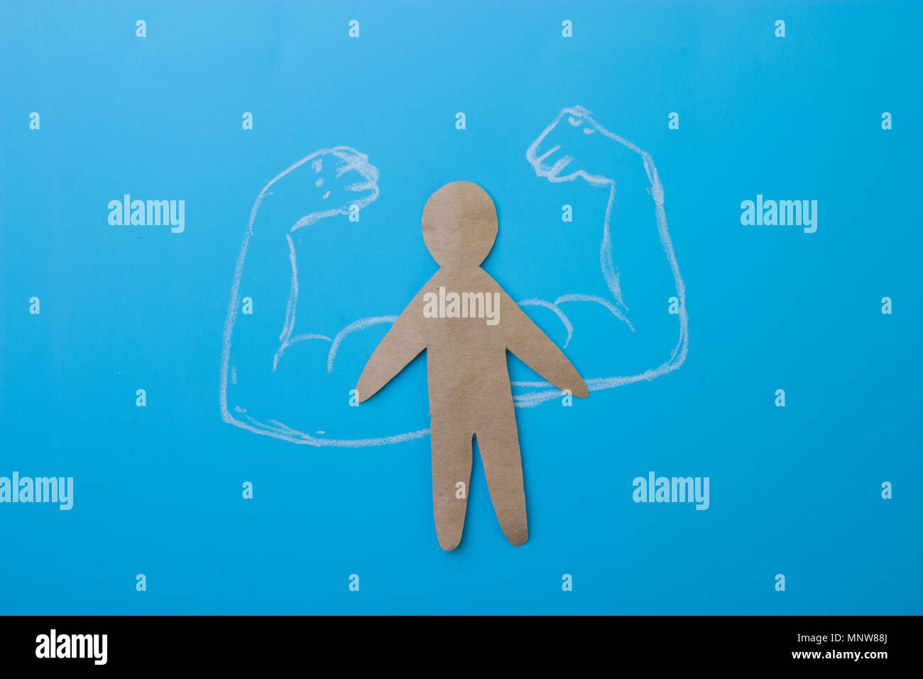 paper man with muscles. self confidence concept Stock Photo - Alamy