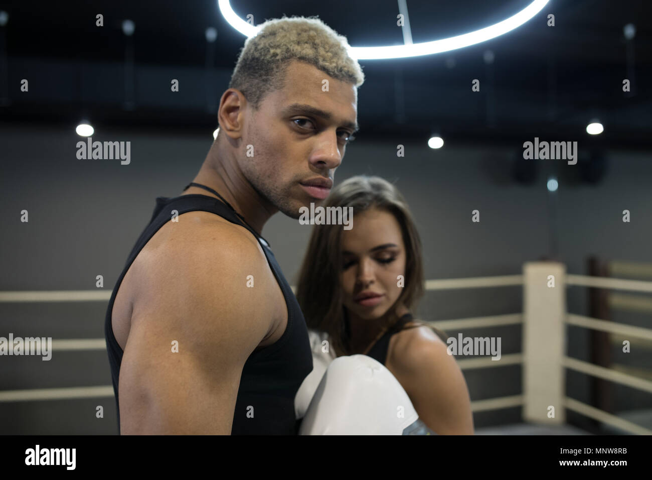 Beautiful sports couple in a boxing ring Stock Photo - Alamy