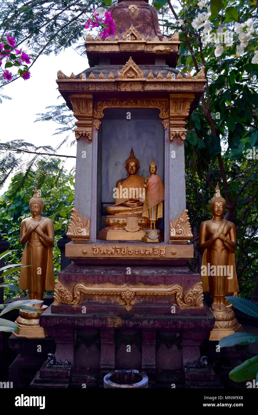 small gold statues at wat saket, the golden mount temple in bangkok ...