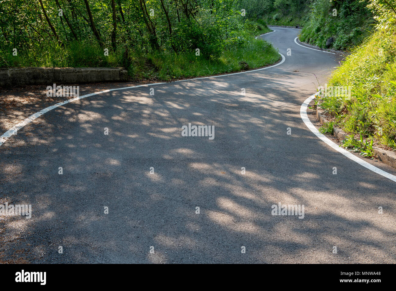 road with mountain curves Stock Photo - Alamy