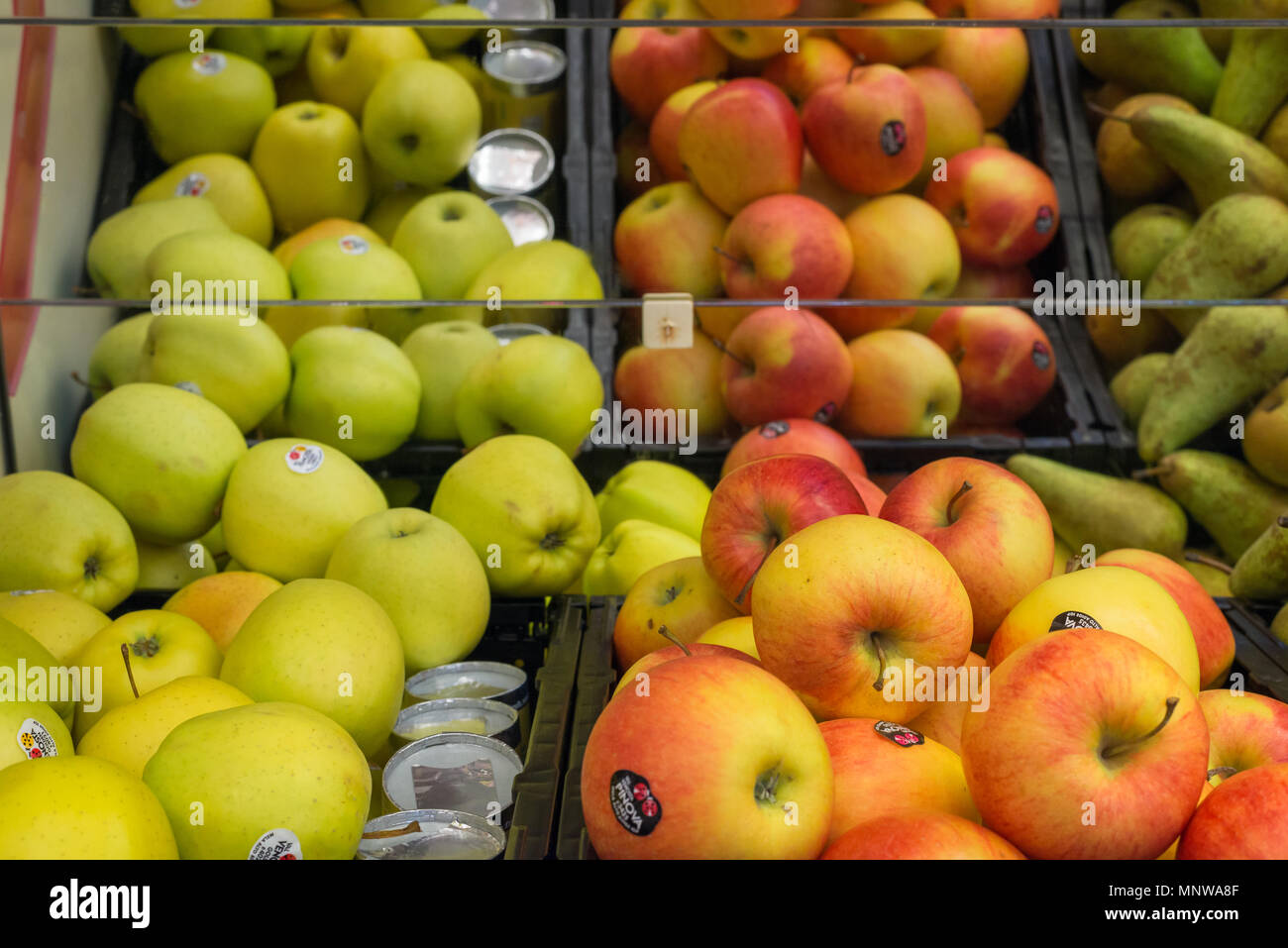 Small fruit stand with yellow and red apples, and pears Stock Photo - Alamy