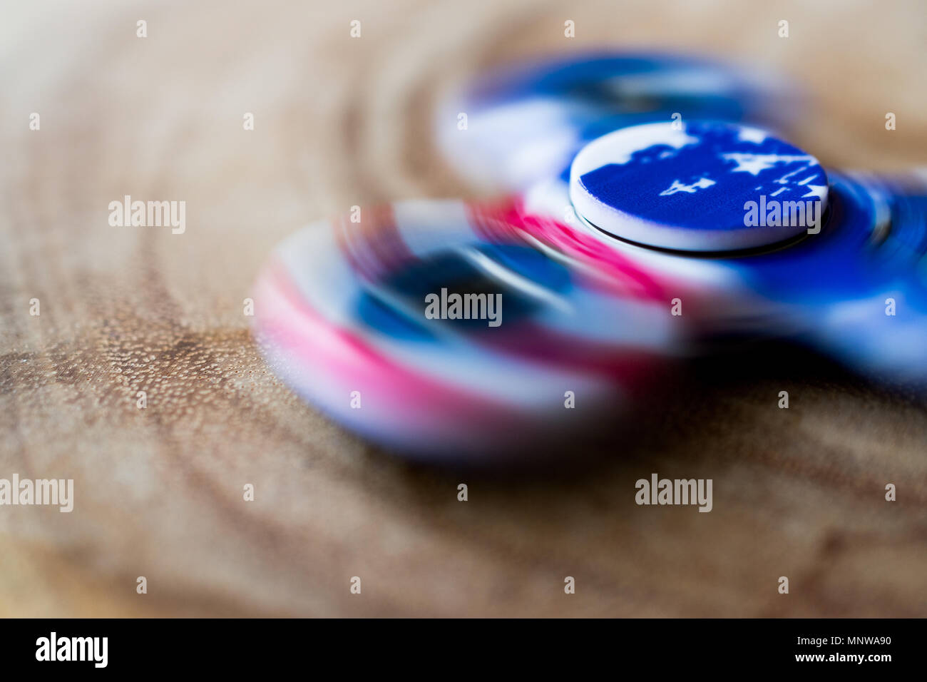 Fidget Spinner on a grey surface. Toy Concept Stock Photo - Alamy
