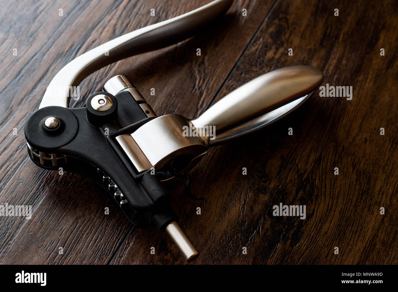 Rabbit Corkscrew on dark wooden surface. Beverage Tool Stock Photo - Alamy