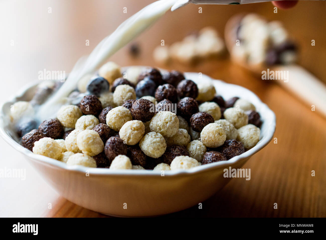 Chocolate Corn balls with milk pouring. Breakfast Concept Stock Photo ...