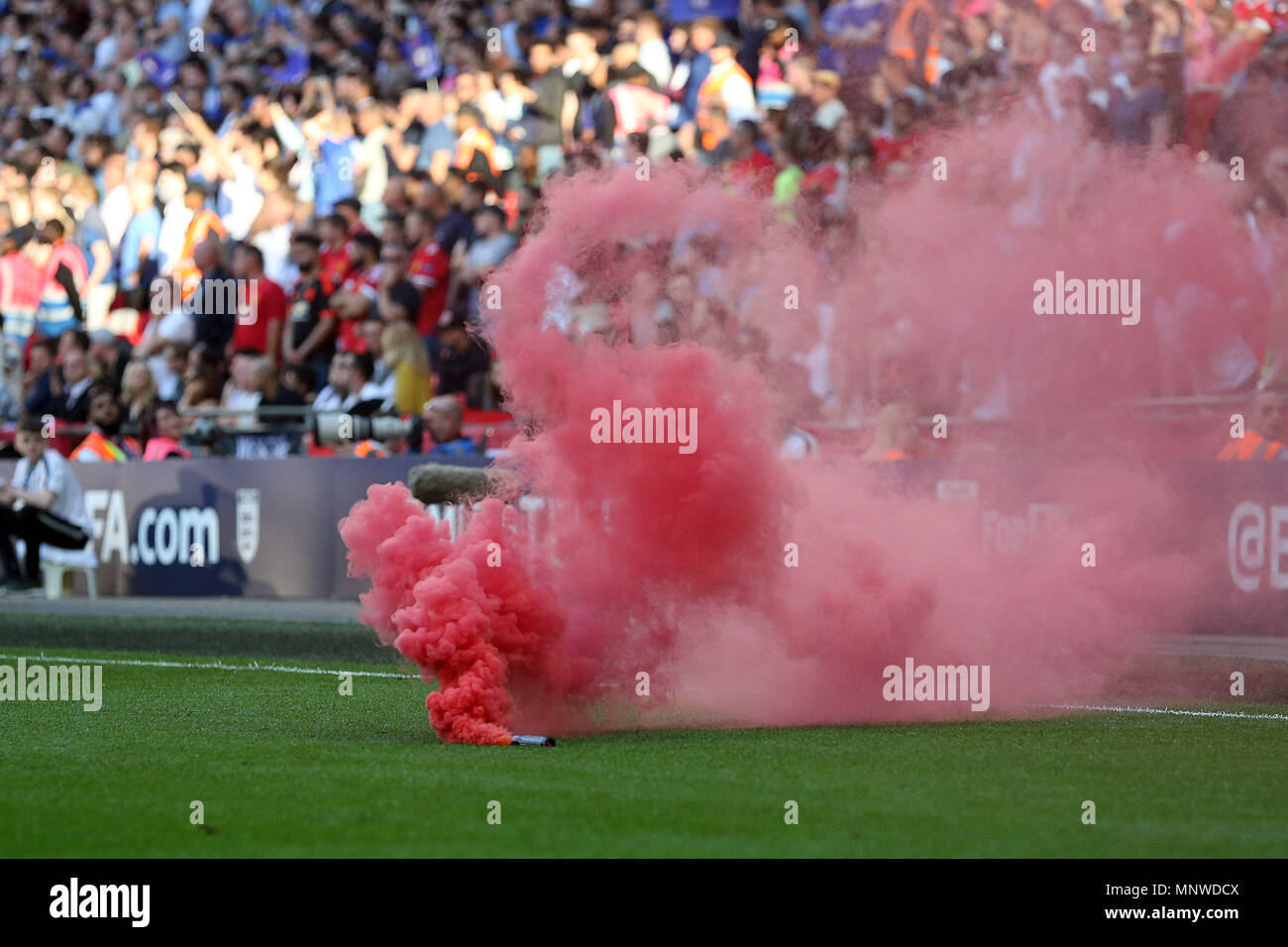 A red flare is thrown onto the pitch during the FA Cup Final match ...
