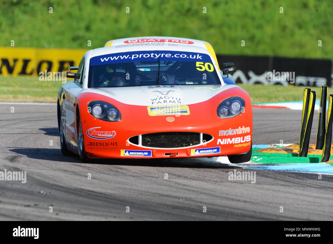 Racecar driver racing around racetrack hi-res stock photography and ...