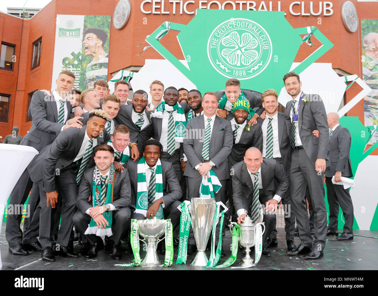 Celtic pose with this seasons trophies during the parade at Celtic Park ...