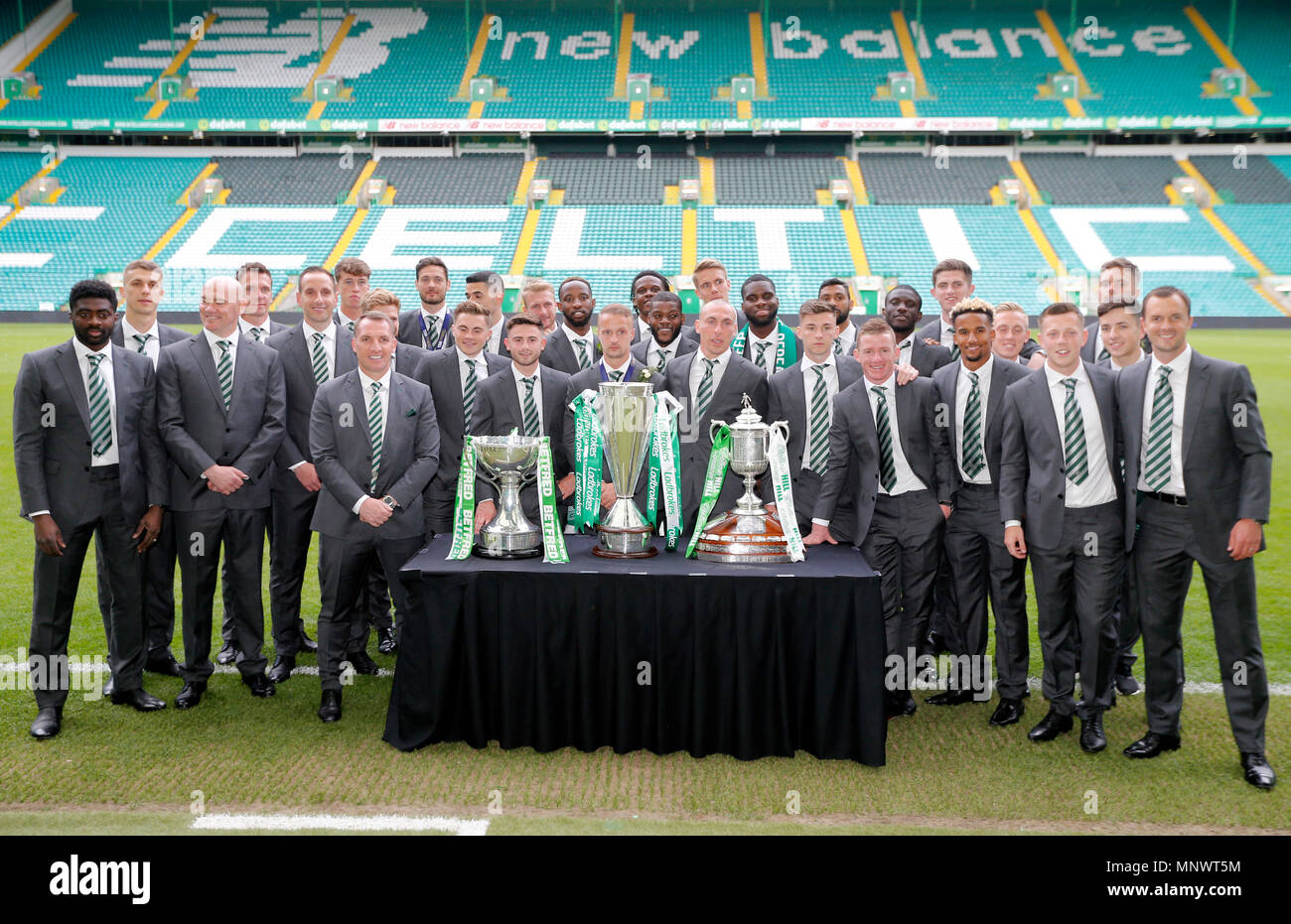 Celtic pose with this seasons trophies after the parade at Celtic Park ...