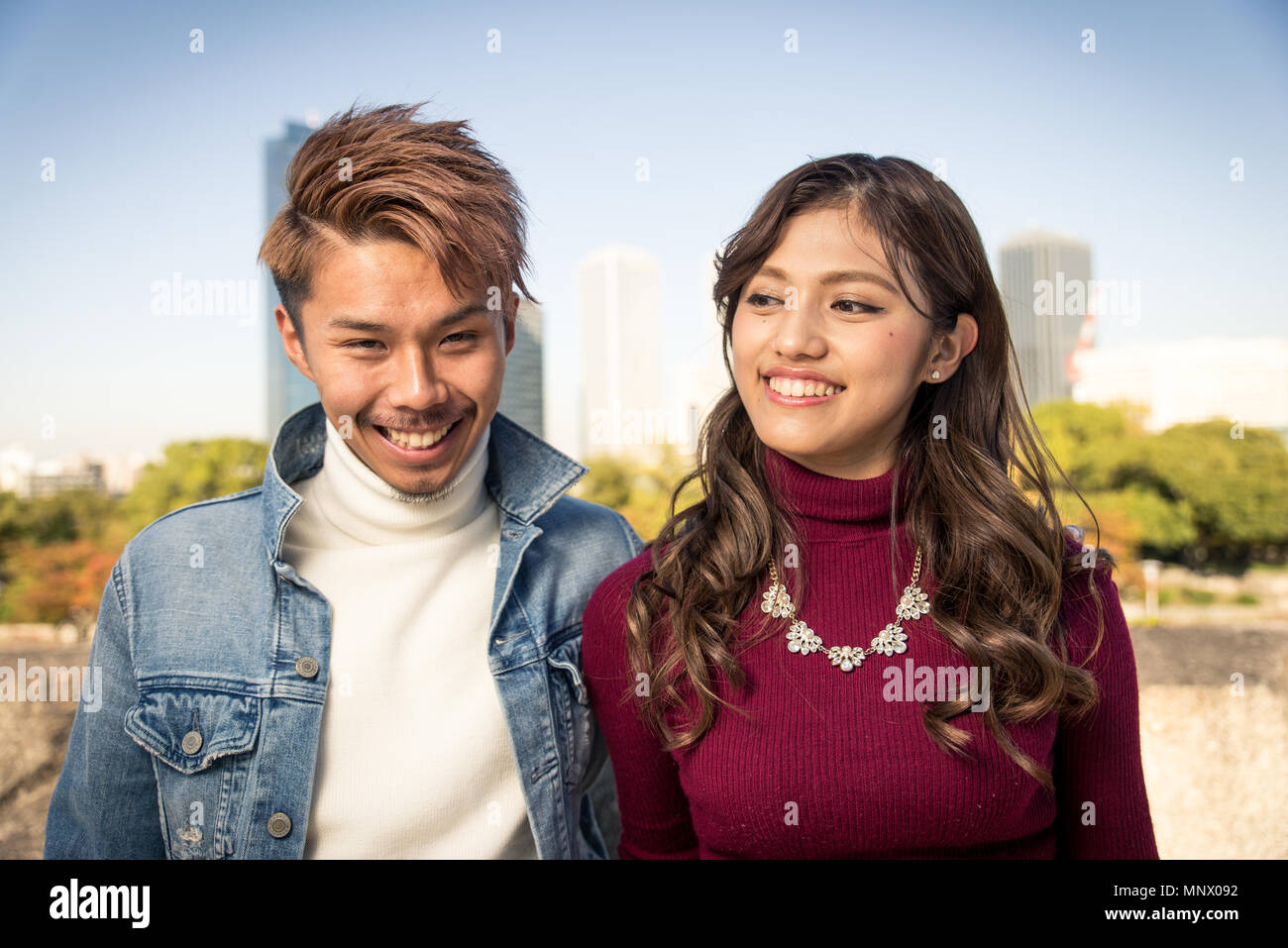 Young japanese couple dating outdoors Stock Photo - Alamy