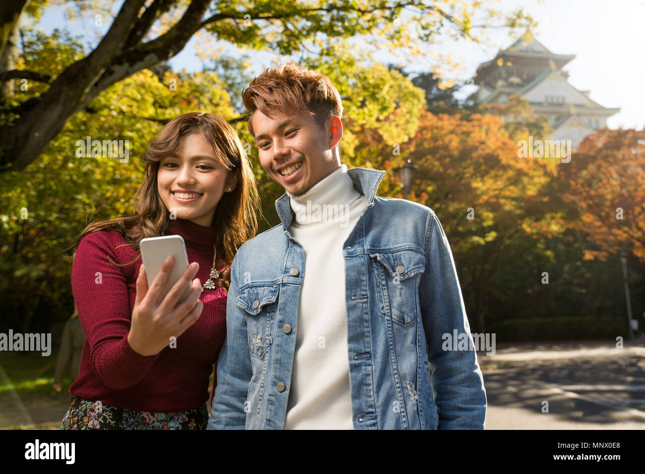 Young japanese couple dating outdoors Stock Photo - Alamy