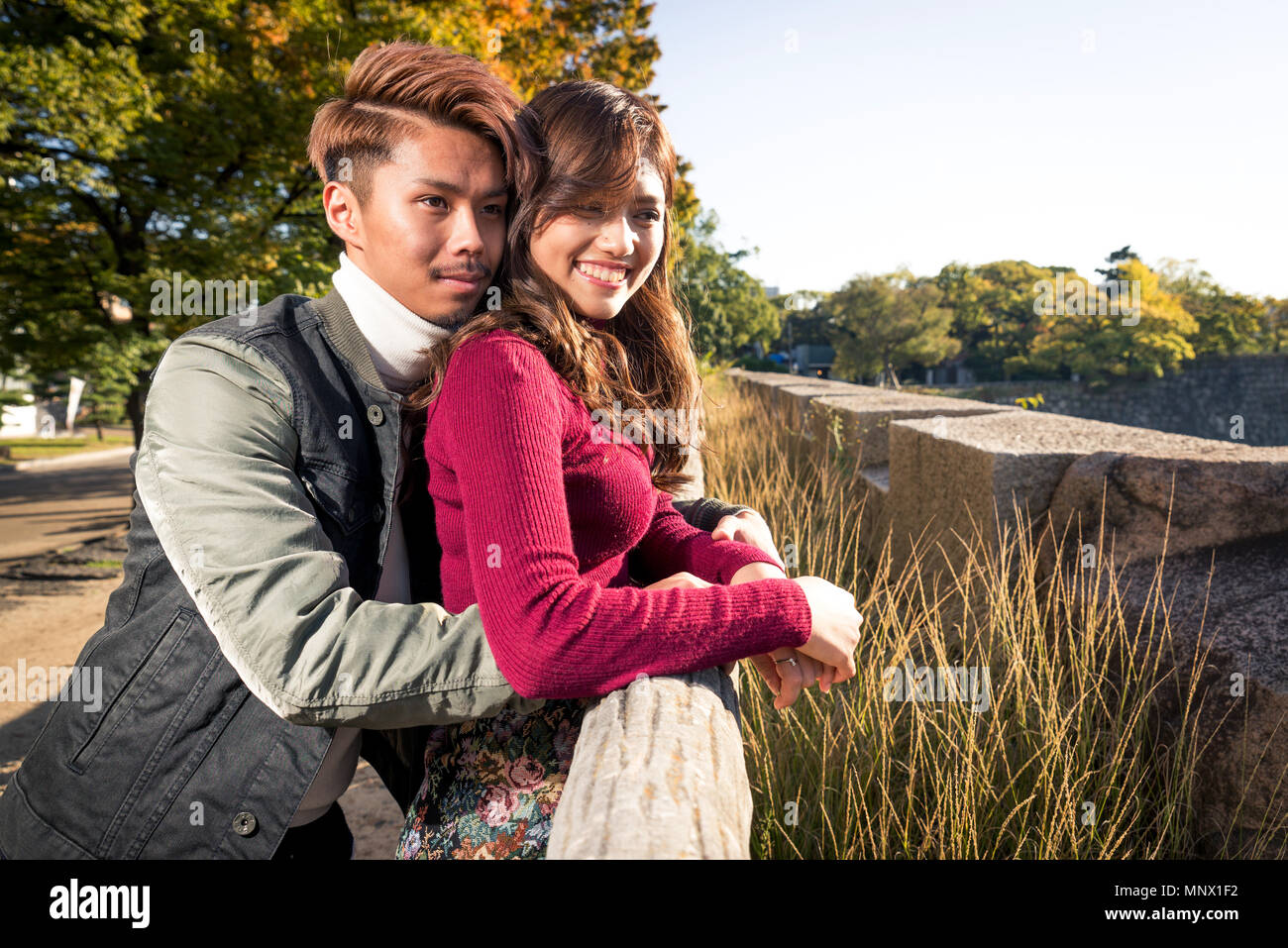 Young japanese couple dating outdoors Stock Photo - Alamy