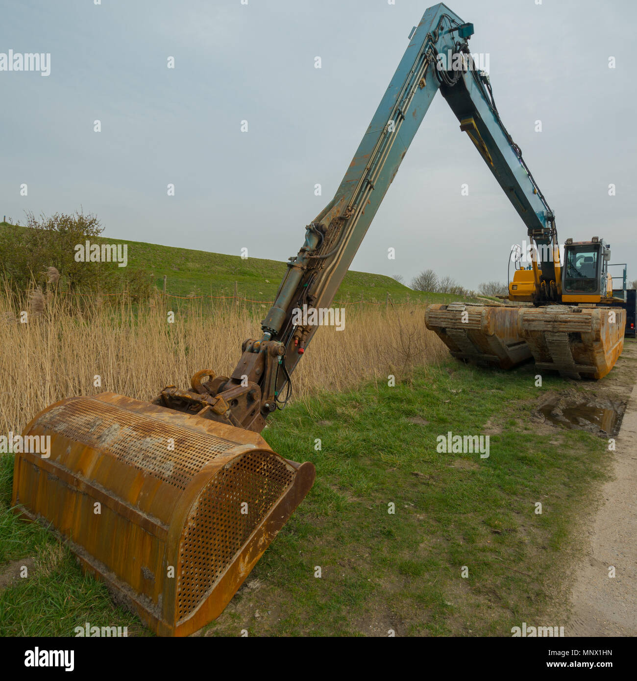 Wide angle image of bulldozer with swamp tracks Stock Photo - Alamy