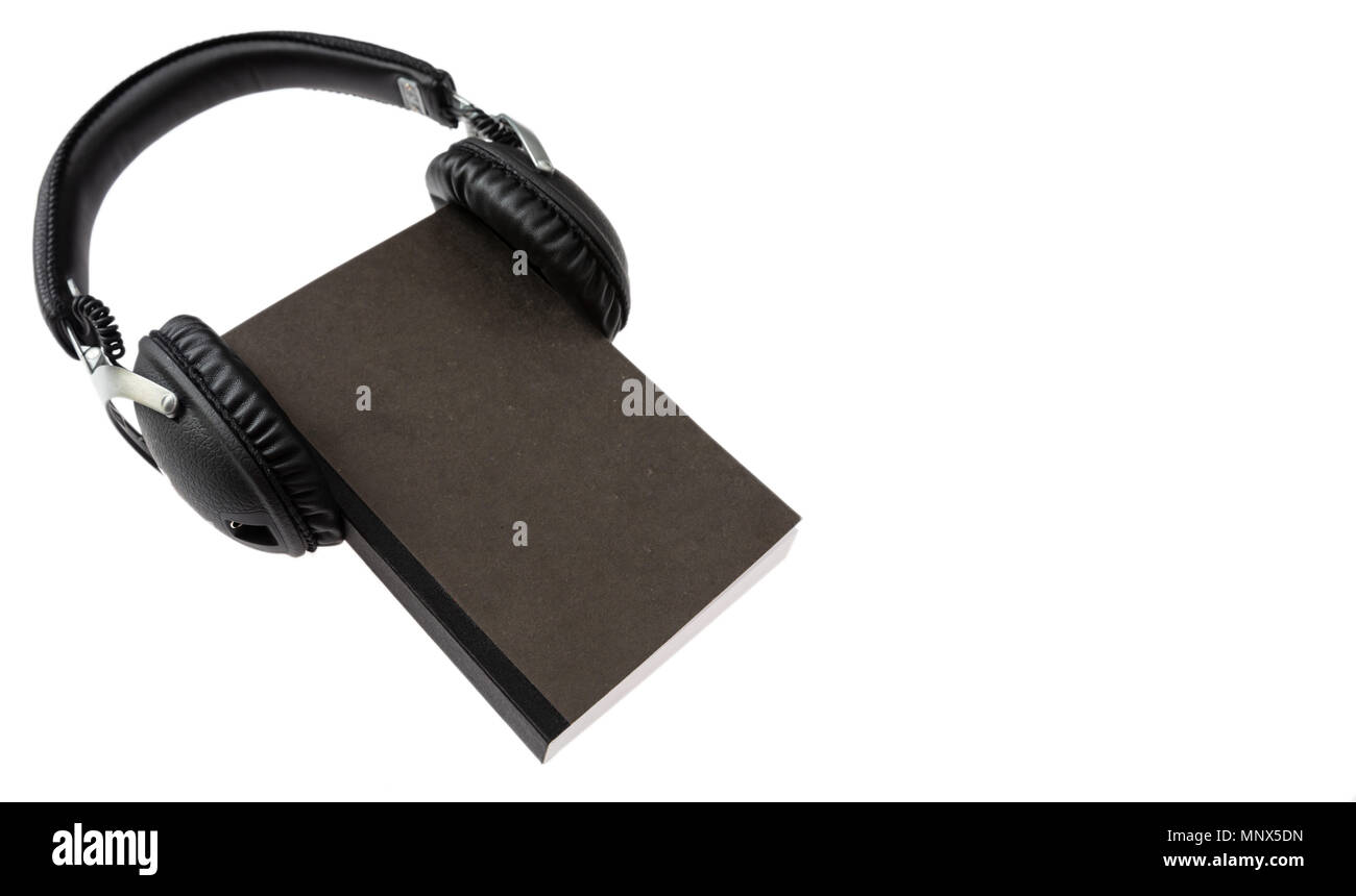 Audio book concept. Black book and wireless headphones set isolated on ...