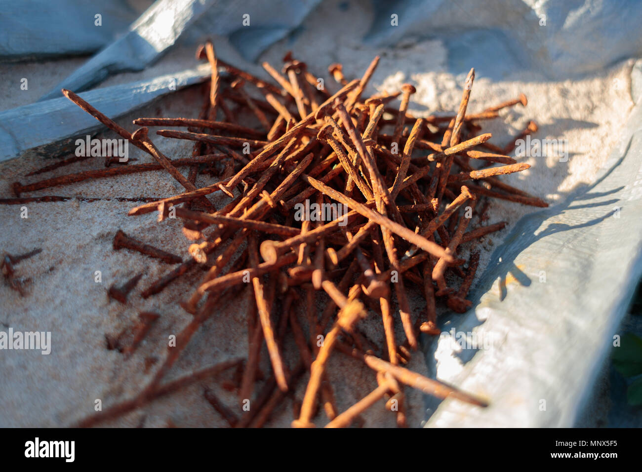 small pile of rusty nails in the daytime Stock Photo - Alamy