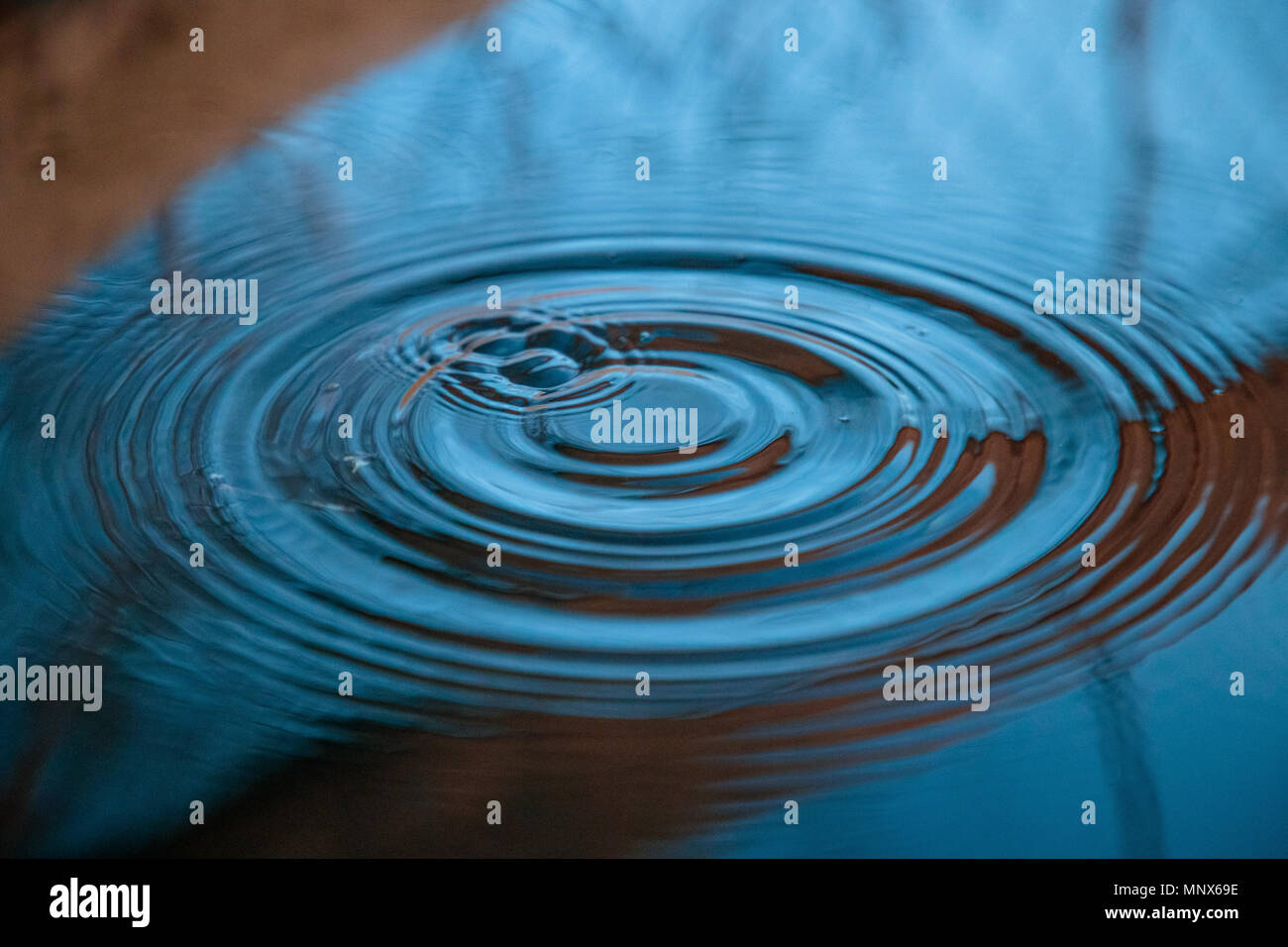 drop in clean water and circular stains Stock Photo - Alamy