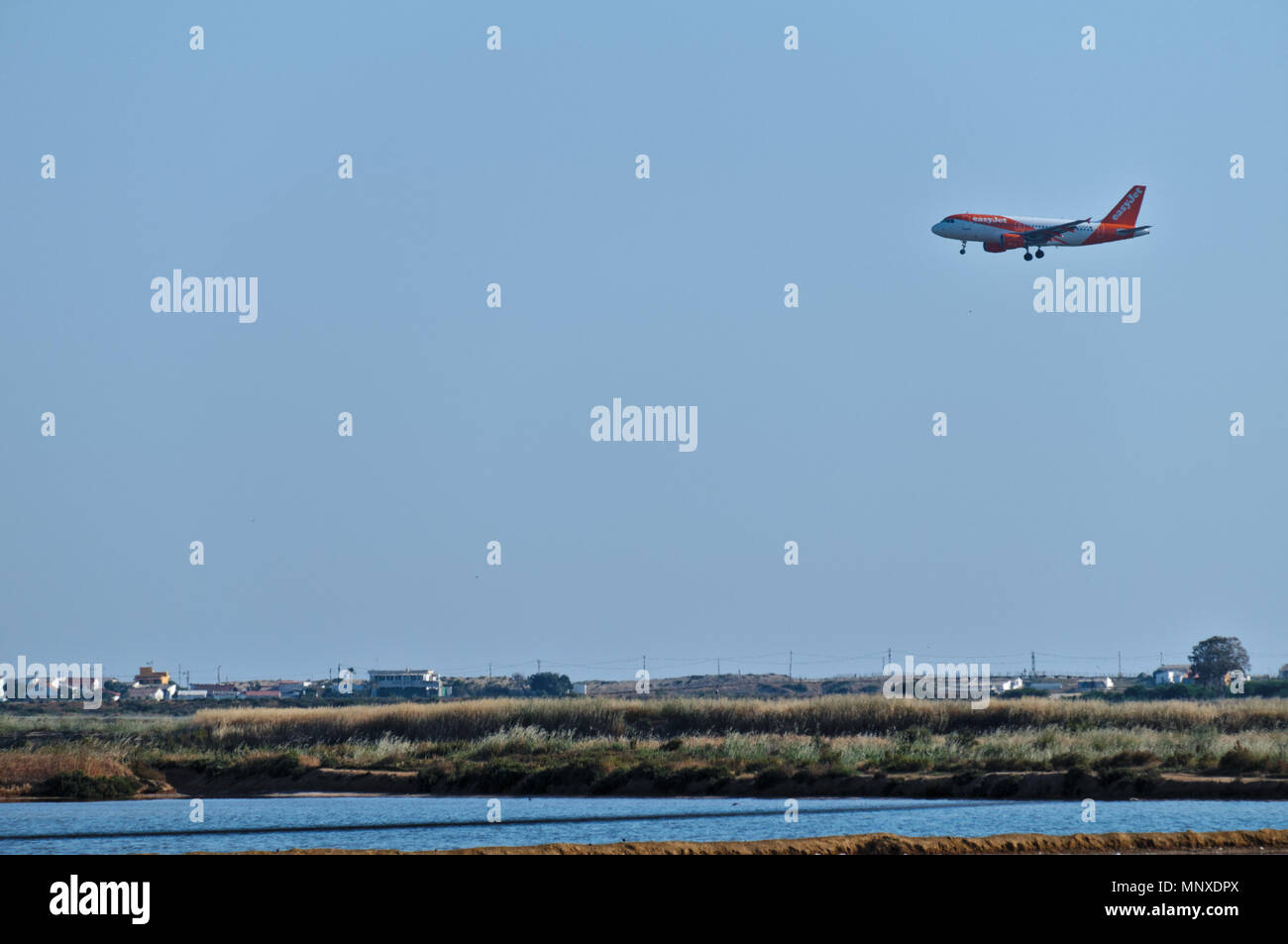 Easyjet airplane landing at Faro Airport. Algarve, Portugal Stock Photo ...