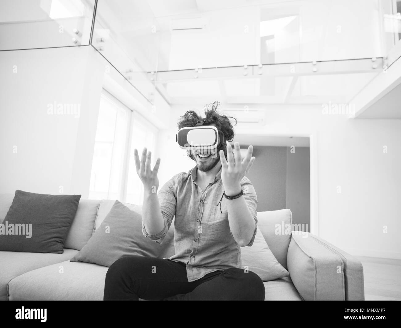 happy man getting experience using VR-headset glasses of virtual ...