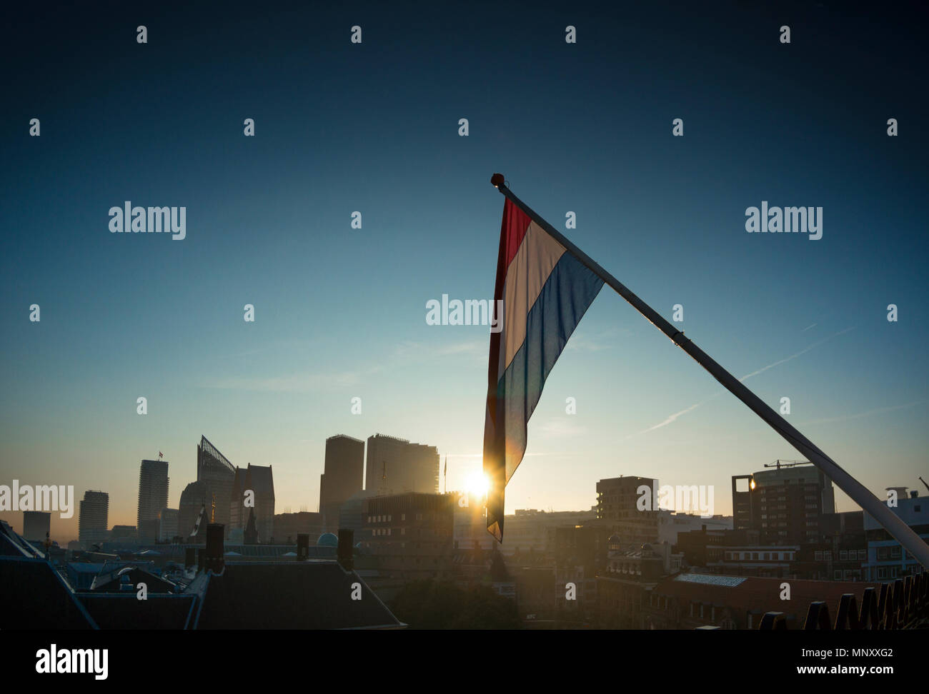 skyline The Hague sunrise with Dutch flag Stock Photo - Alamy