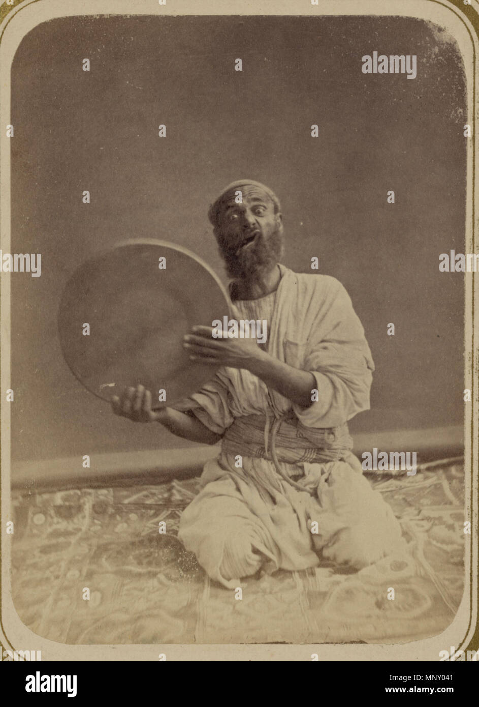 1206 Troupe of Musicians. A Maskhara-bāz, or Entertainer, Holding a ...