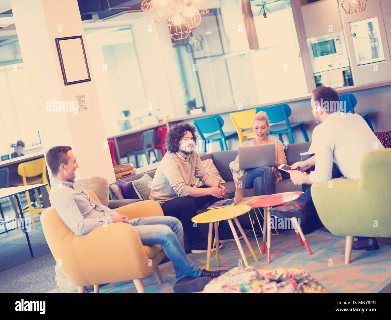 Group of a young business people discussing business plan at modern ...