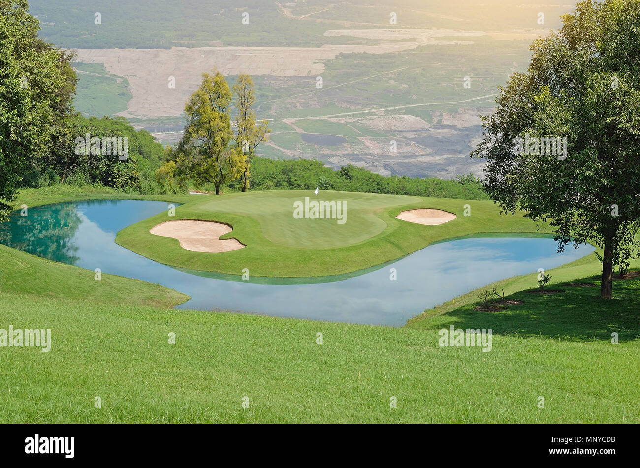 Golf course with gorgeous green and pond Stock Photo - Alamy